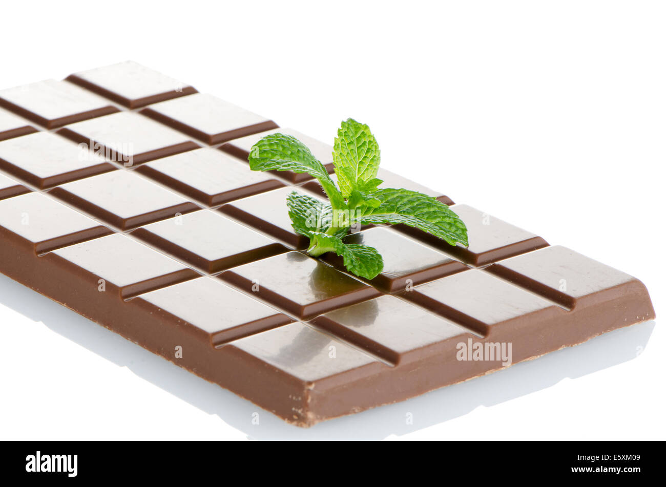 Closeup detail of chocolate and mint leaves on white background Stock ...