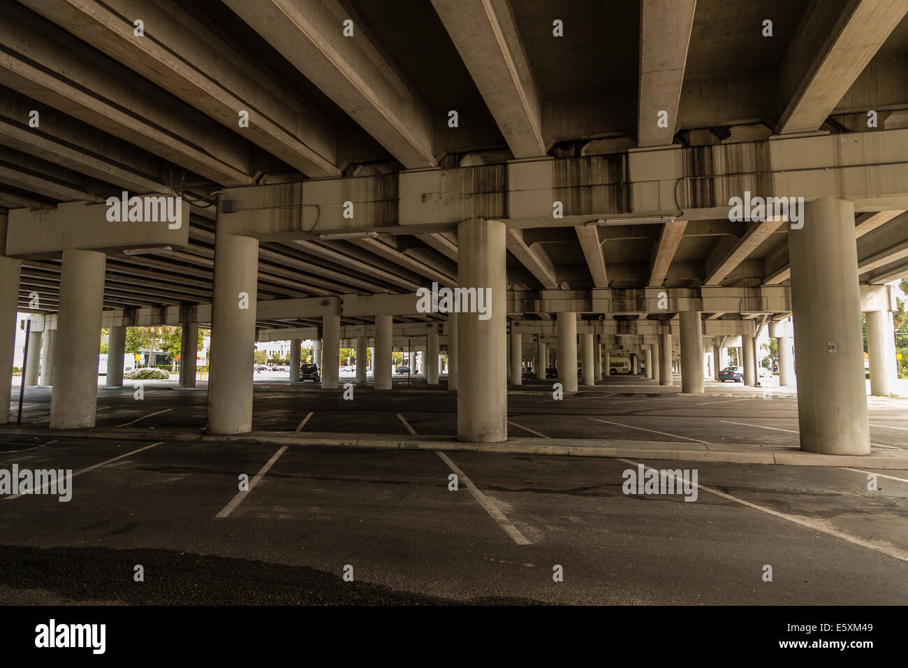 Parking lot under overpass Stock Photo - Alamy