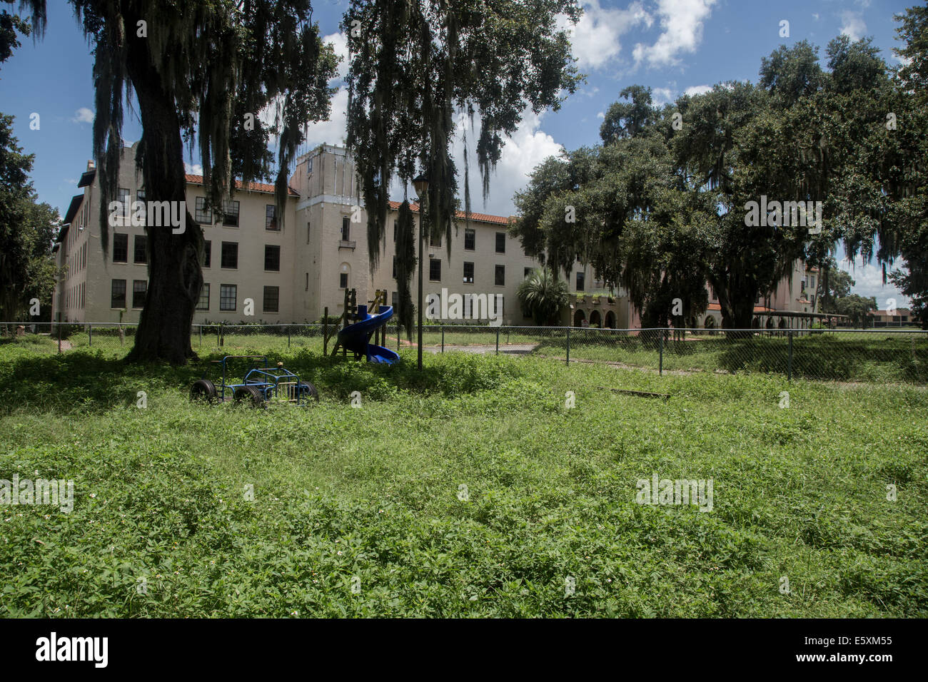 Overgrown playground at abandoned church Stock Photo - Alamy