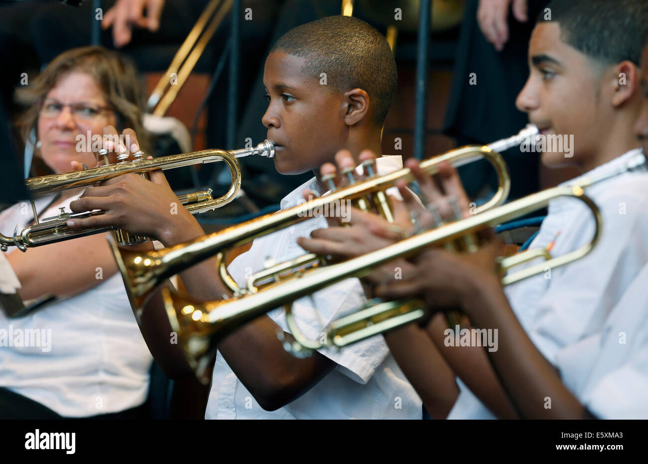 Students play with the Boston Landmarks Orchestra during a concert at ...
