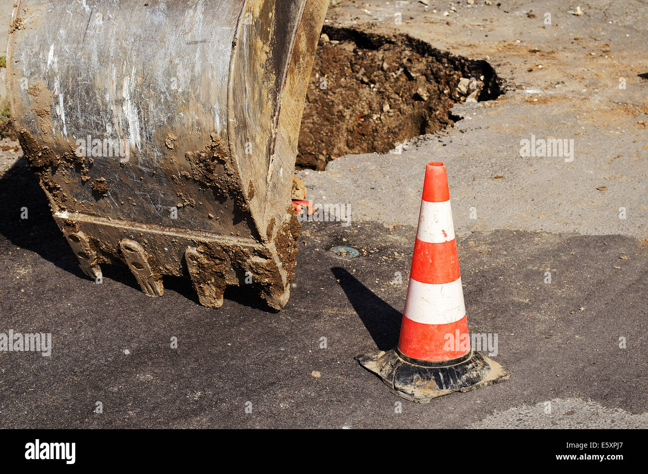 Public street day maintenance works, excavator work Stock Photo - Alamy