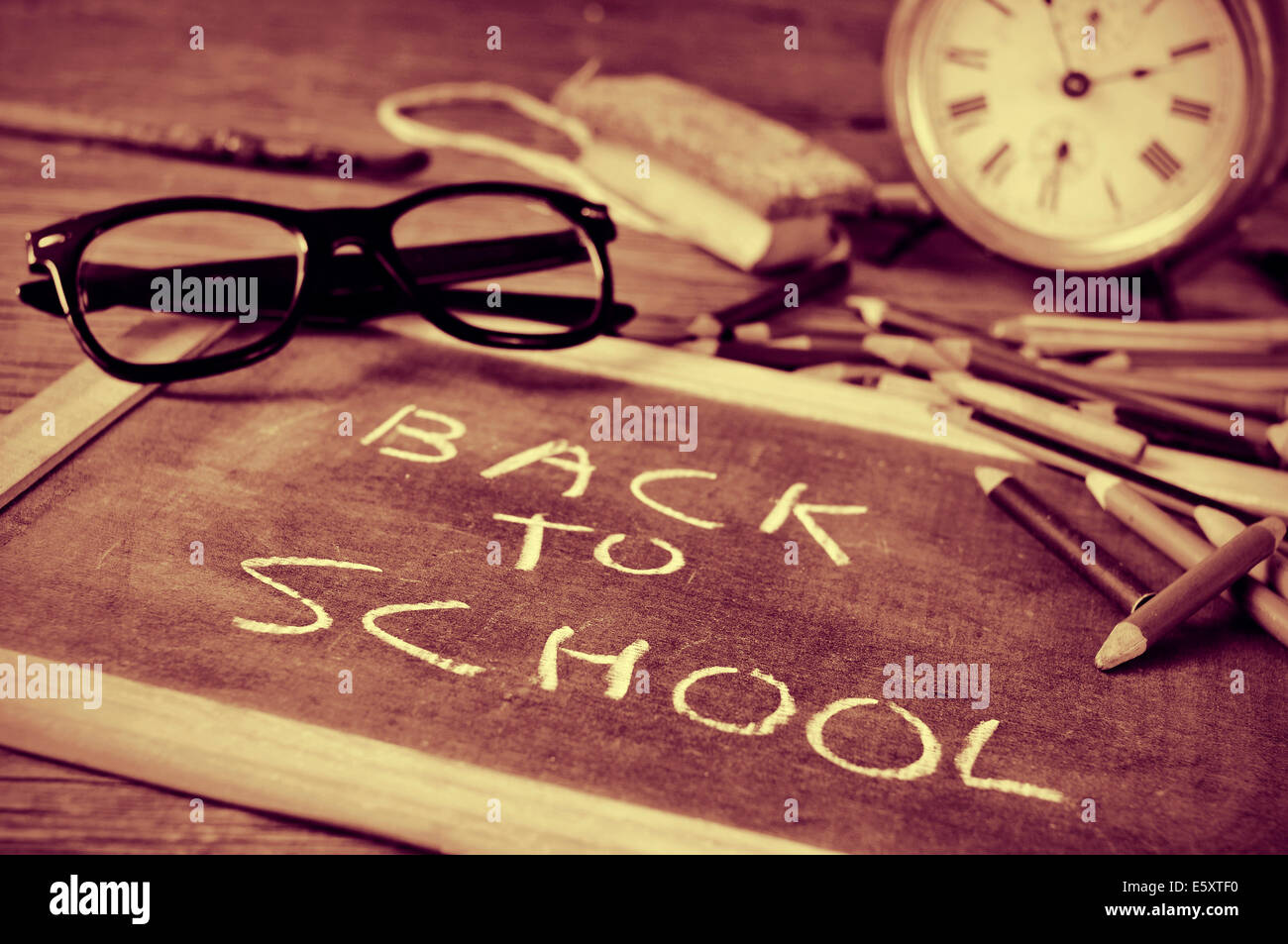 a chalkboard with the sentence back to school written in it, on a ...