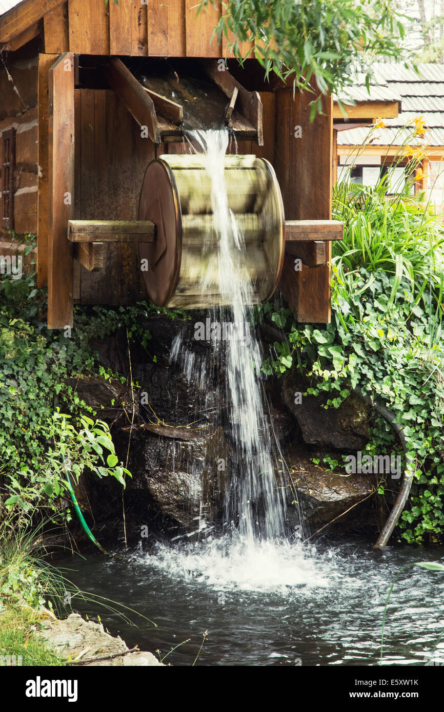 Small water mill in the garden Stock Photo - Alamy