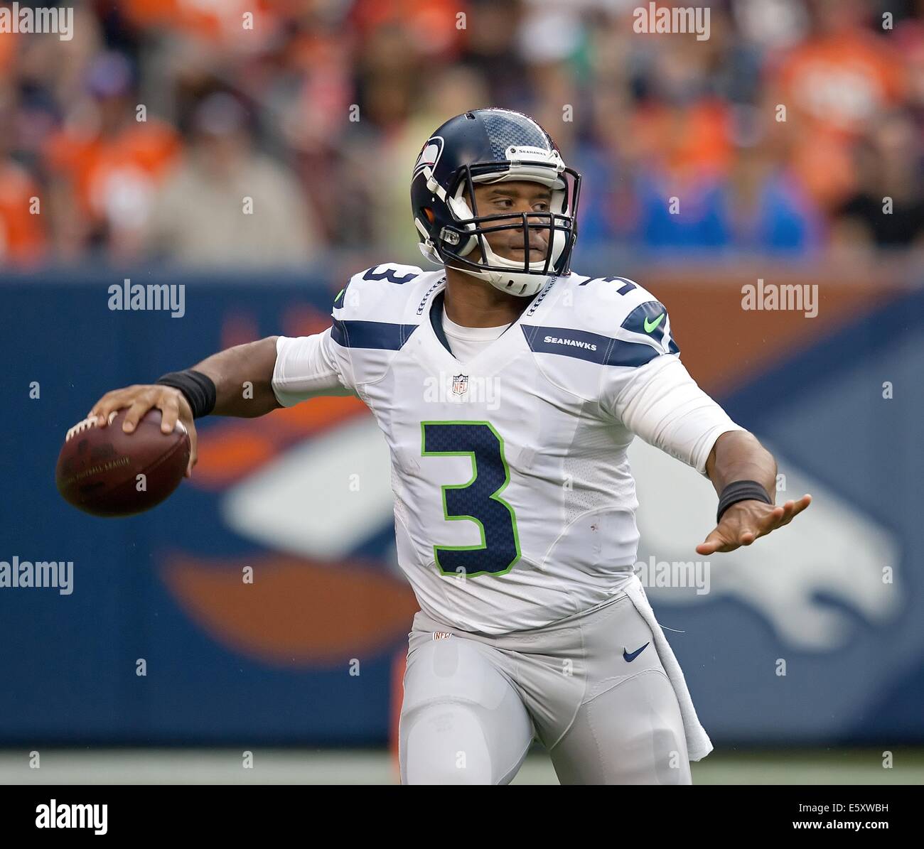 Denver, Colorado, USA. 7th Aug, 2014. Seattle QB RUSSELL WILSON readies ...