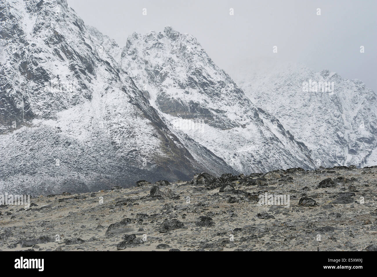 Rocky field of scree in front of snow-covered maountaintops, 22 August ...