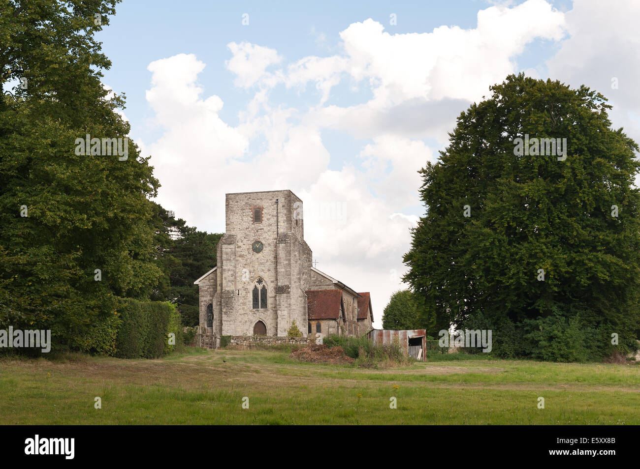 Chart Sutton Norman Church on a changeable weather day in mid summer a ...