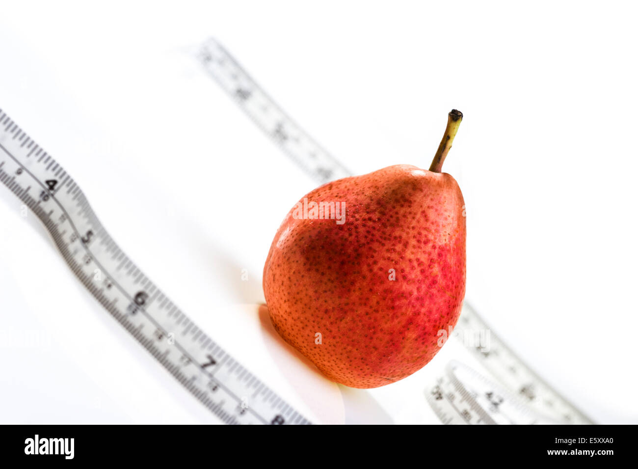 Red pear with tape measure.obesity, weight loss, dieting Stock Photo ...