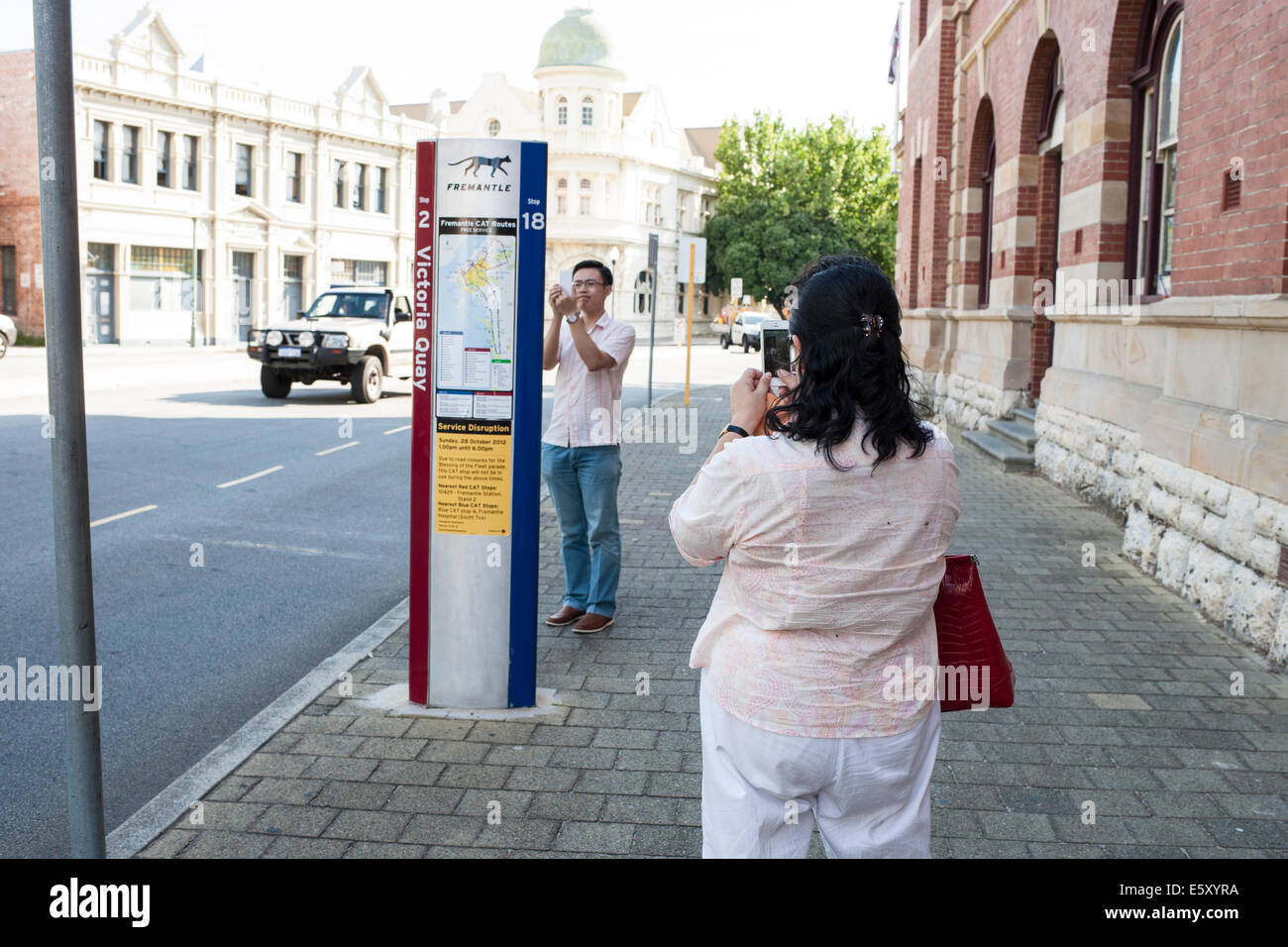 Tourists photographing street directions, Perth, WA Stock Photo - Alamy
