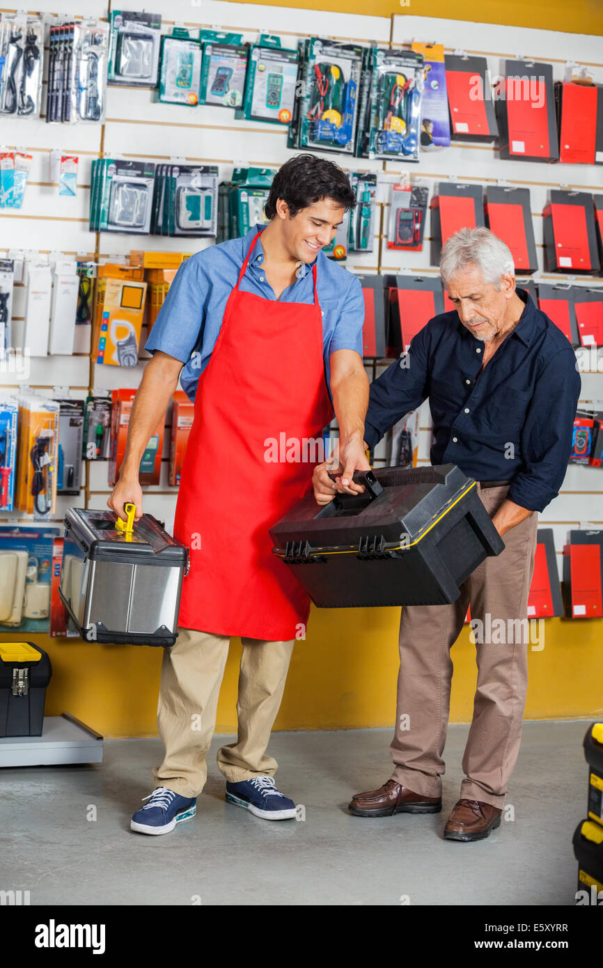 Salesman Assisting Man In Selecting Toolbox At Store Stock Photo - Alamy