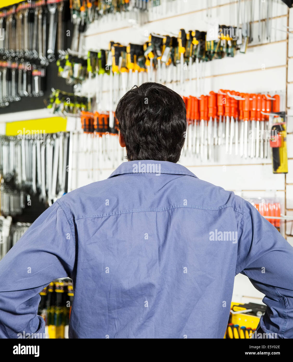 Rear View Of Customer Standing In Hardware Shop Stock Photo - Alamy