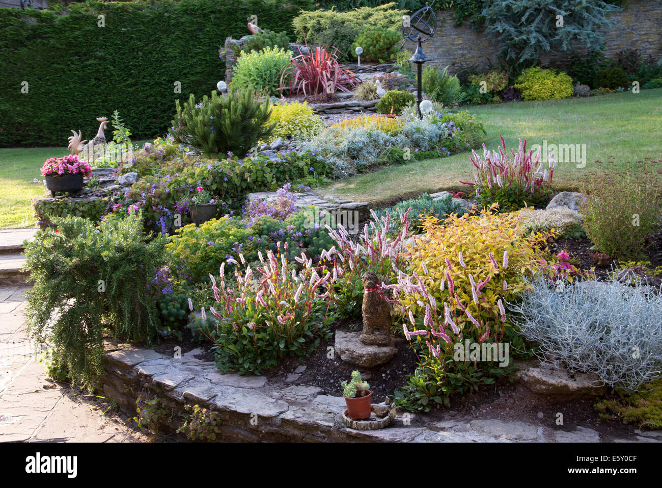 Flower borders in an English country garden Stock Photo - Alamy