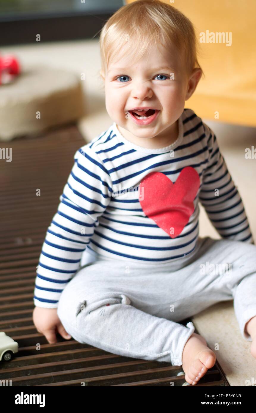 cute toddler with characterful grin Stock Photo - Alamy