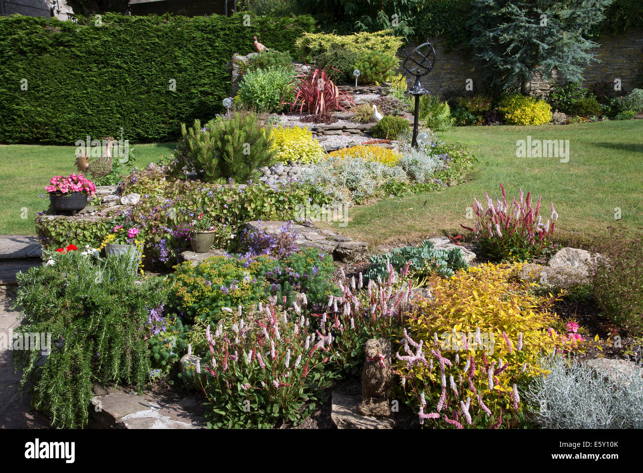 Flower borders in an English country garden Stock Photo - Alamy