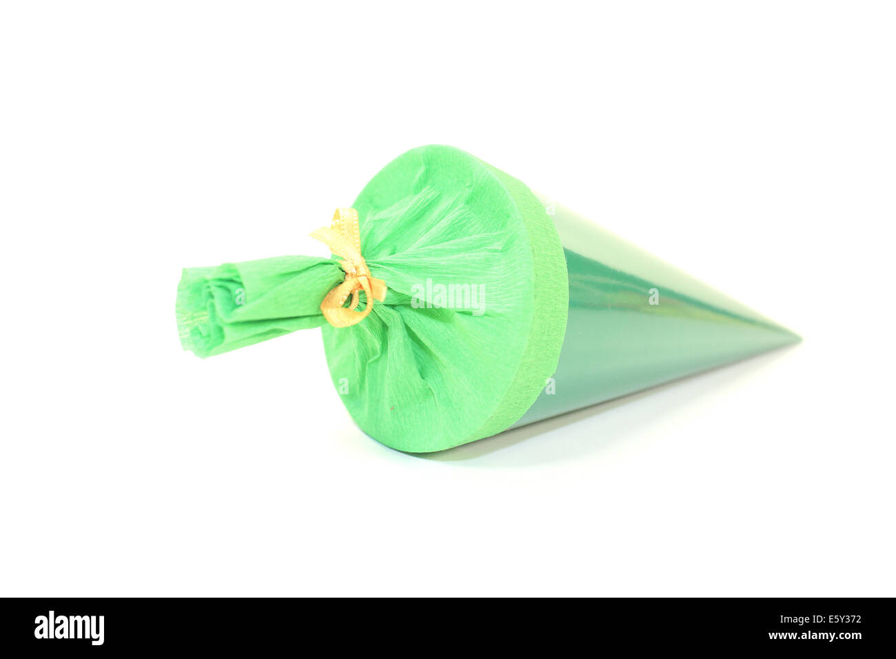 green school cone with yellow ribbon on a light background Stock Photo ...