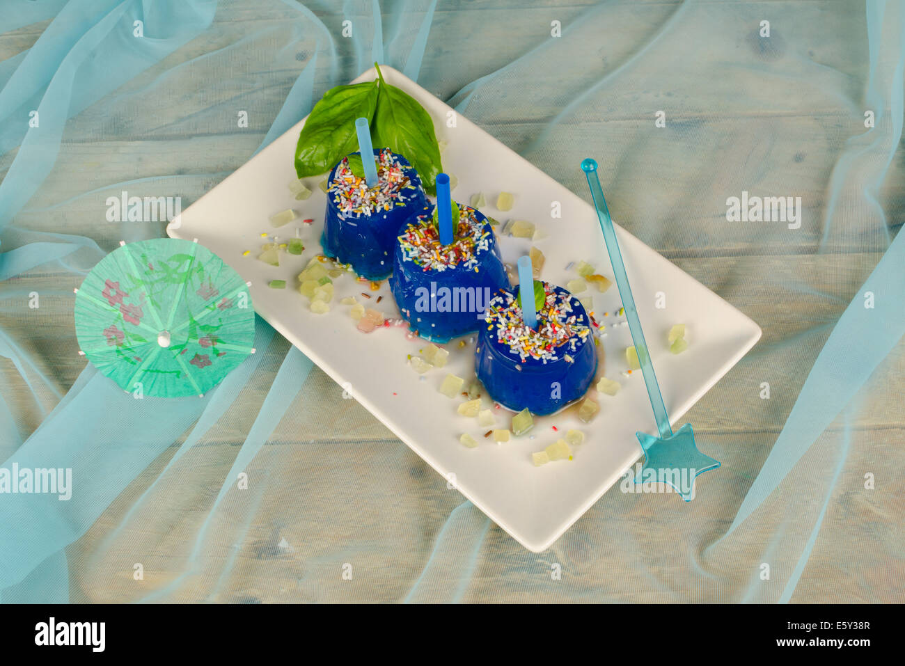 Fruity blue ice pops decorated with sugar sprinkles Stock Photo - Alamy