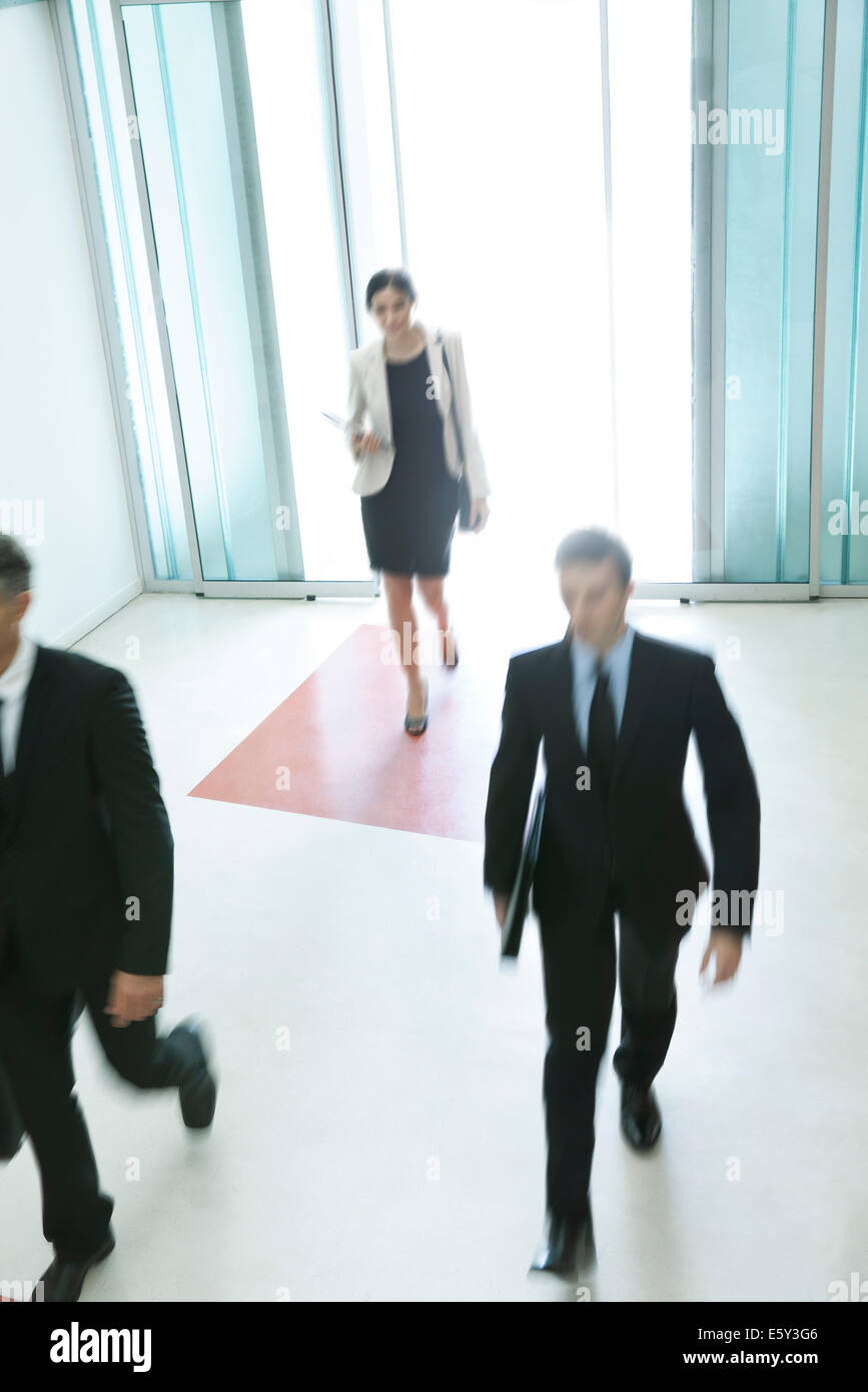 Business professionals arriving for another day of work Stock Photo - Alamy