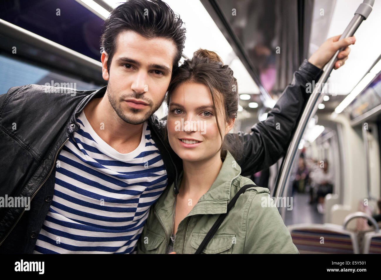 Couple on subway together, portrait Stock Photo - Alamy