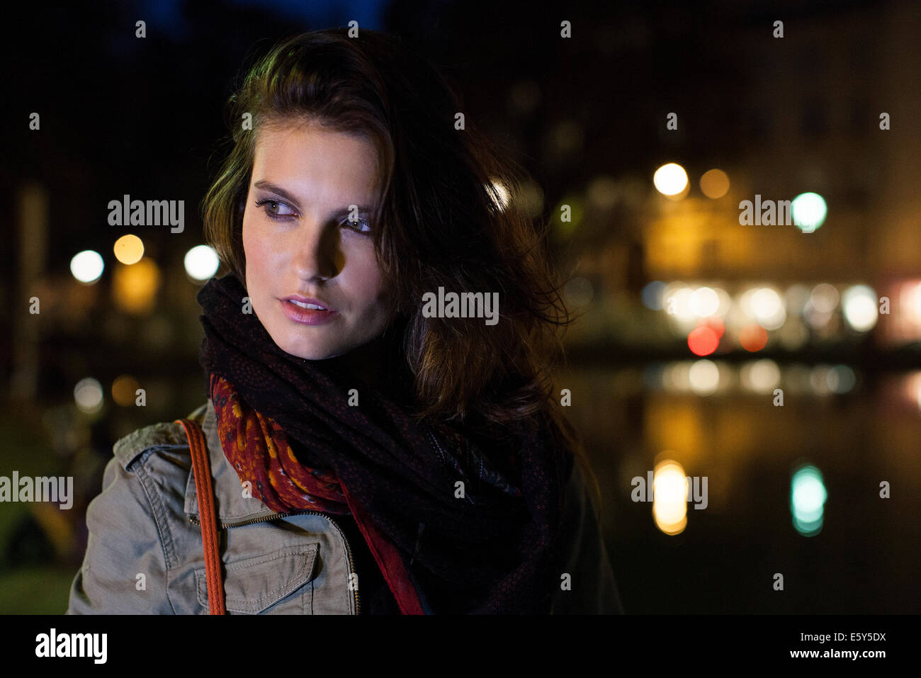 Woman outdoors at night, portrait Stock Photo - Alamy