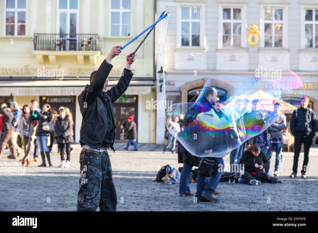 Show blowing big bubbles outdoor with many people Stock Photo - Alamy
