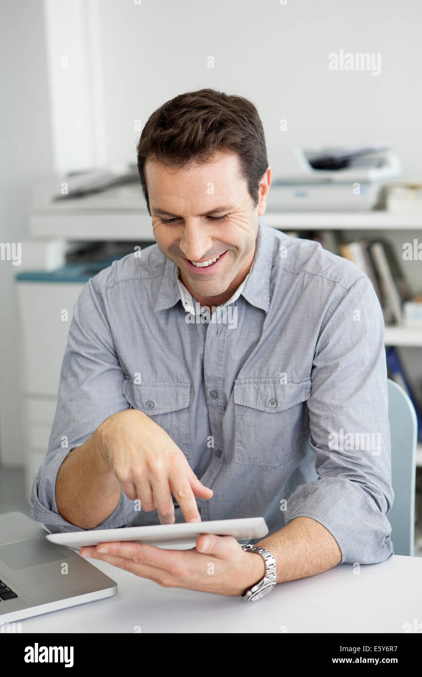 Office worker using digital tablet Stock Photo - Alamy
