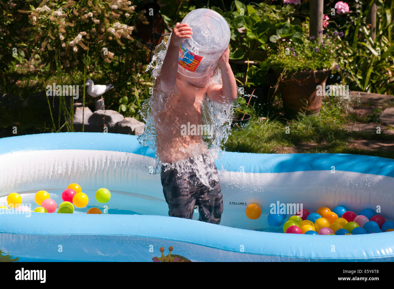 Child getting wet hi-res stock photography and images - Alamy