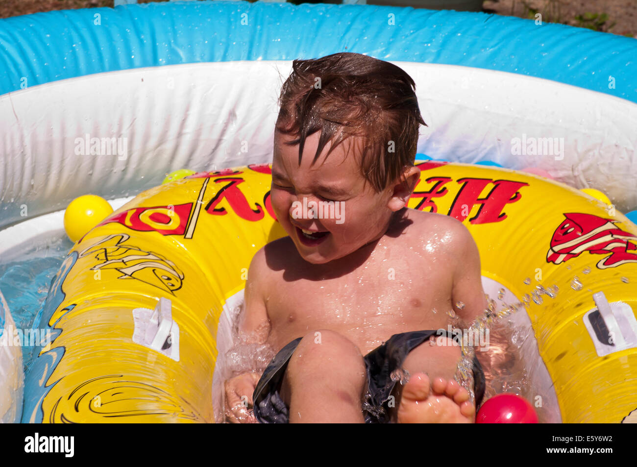 Toddler Having Fun In The Sun Stock Photo - Alamy