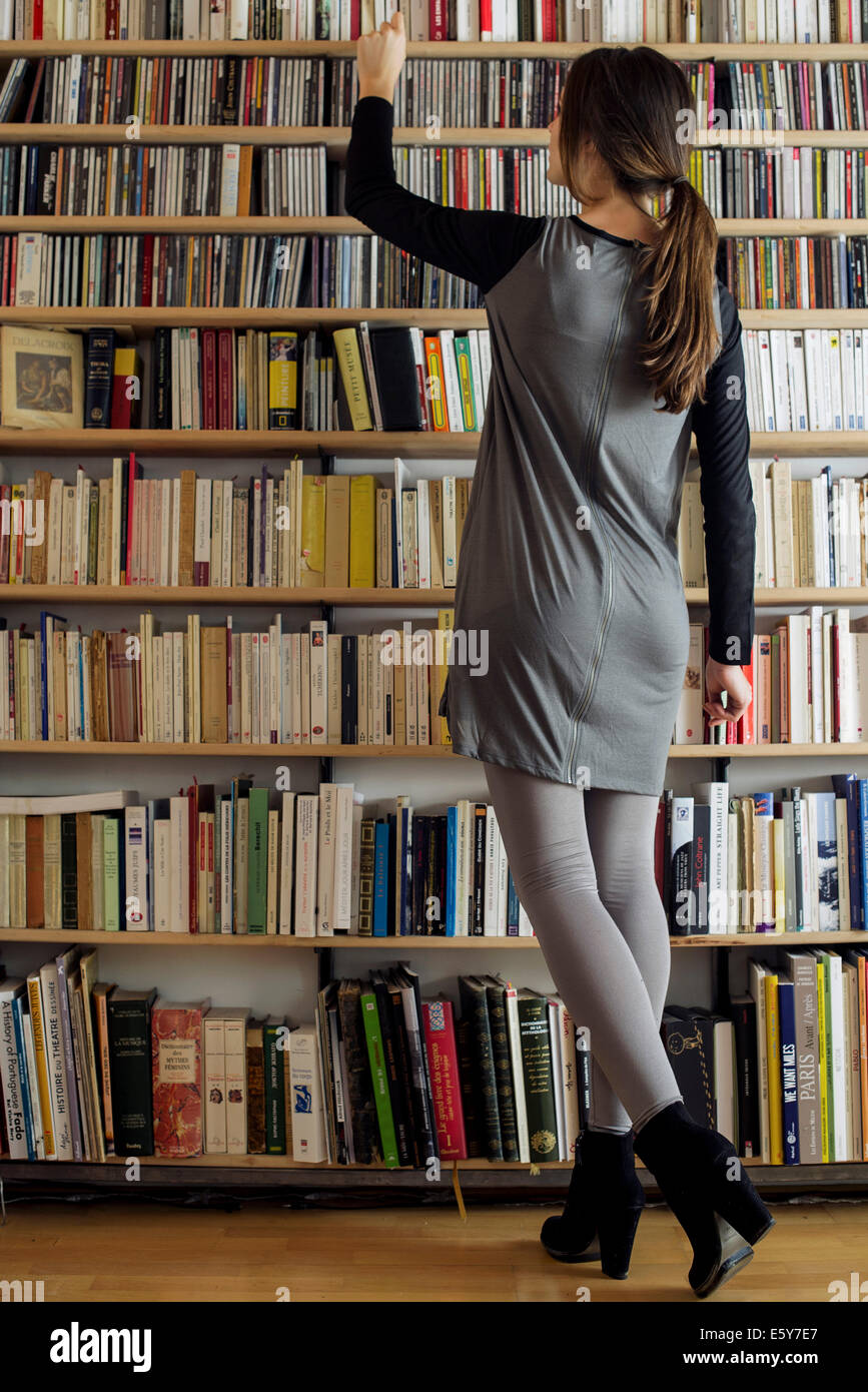 Rear view reaching up woman hi-res stock photography and images - Alamy