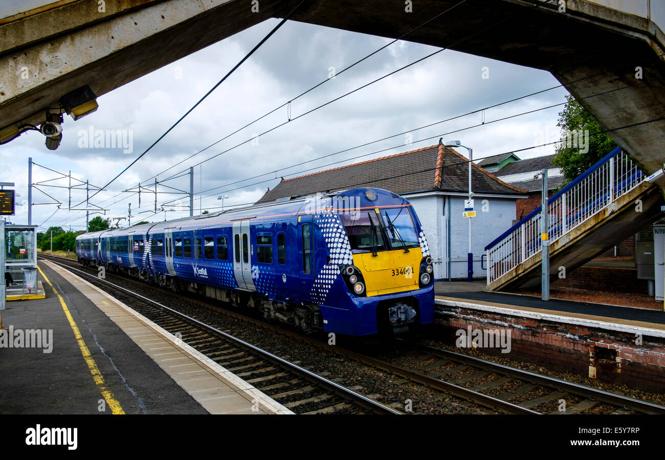 A passenger commuter train arrives at Carluke station in South ...