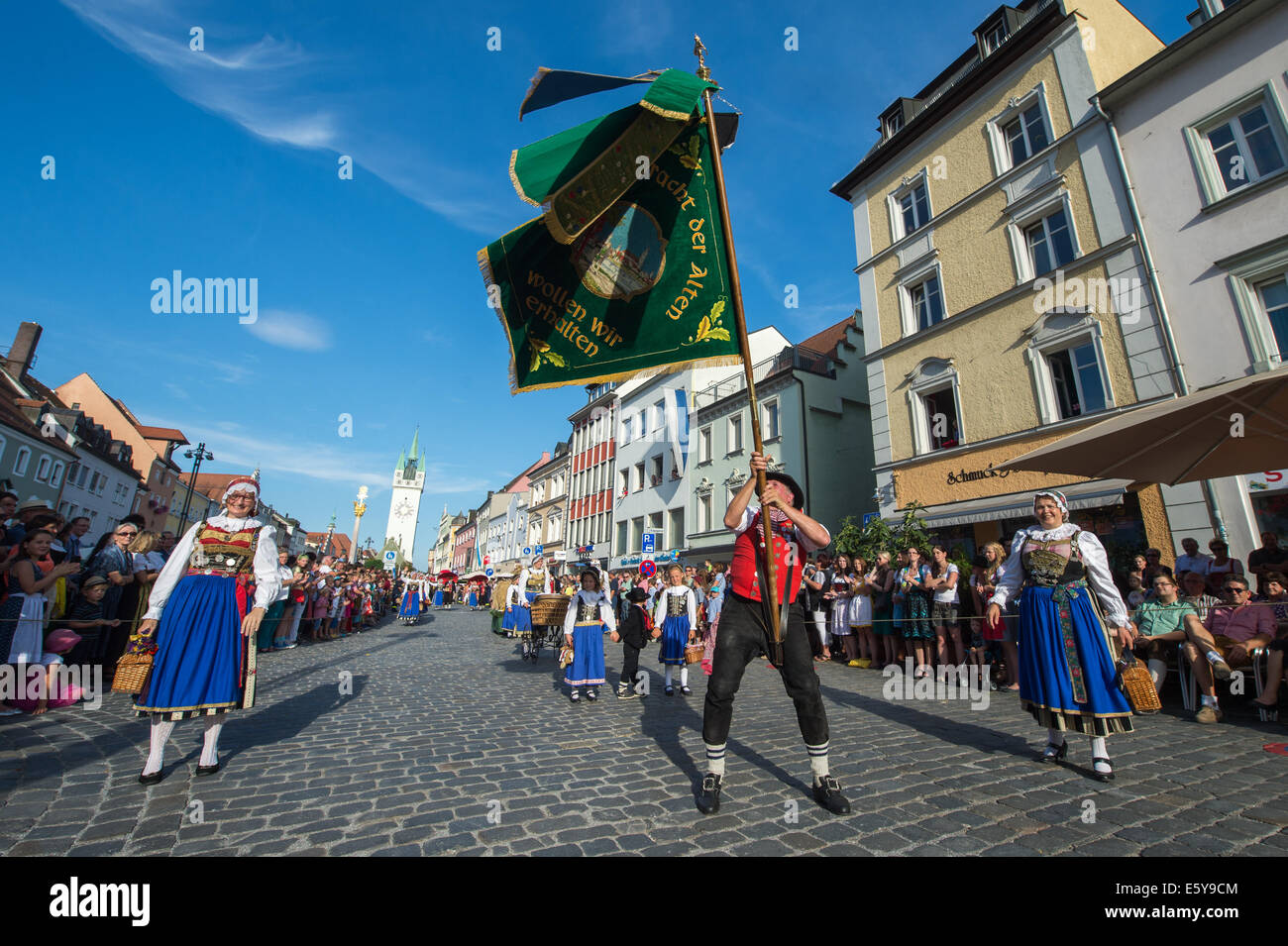A member of the traditional costume parade 'Gaeubodenvolksfest' swings ...