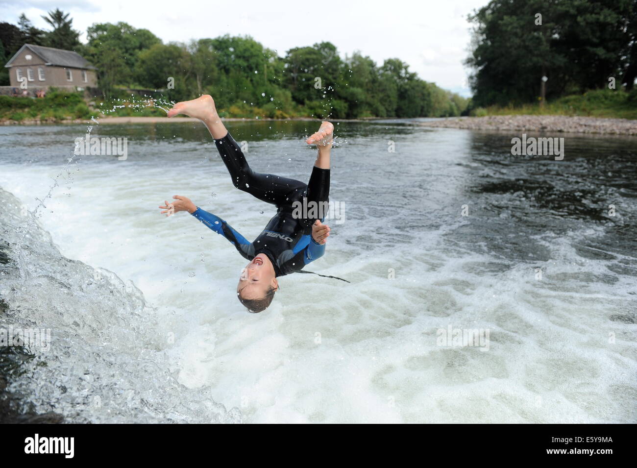 children jumping into the river Usk at Crickhowell, Brecon Beacons in ...