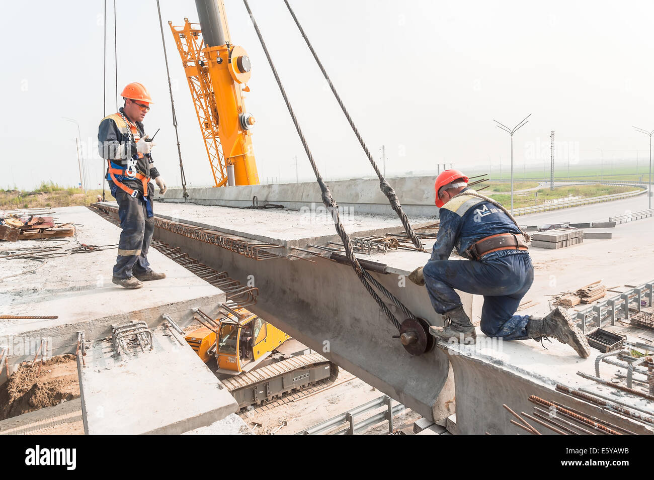 Workers establish bridge span Stock Photo - Alamy
