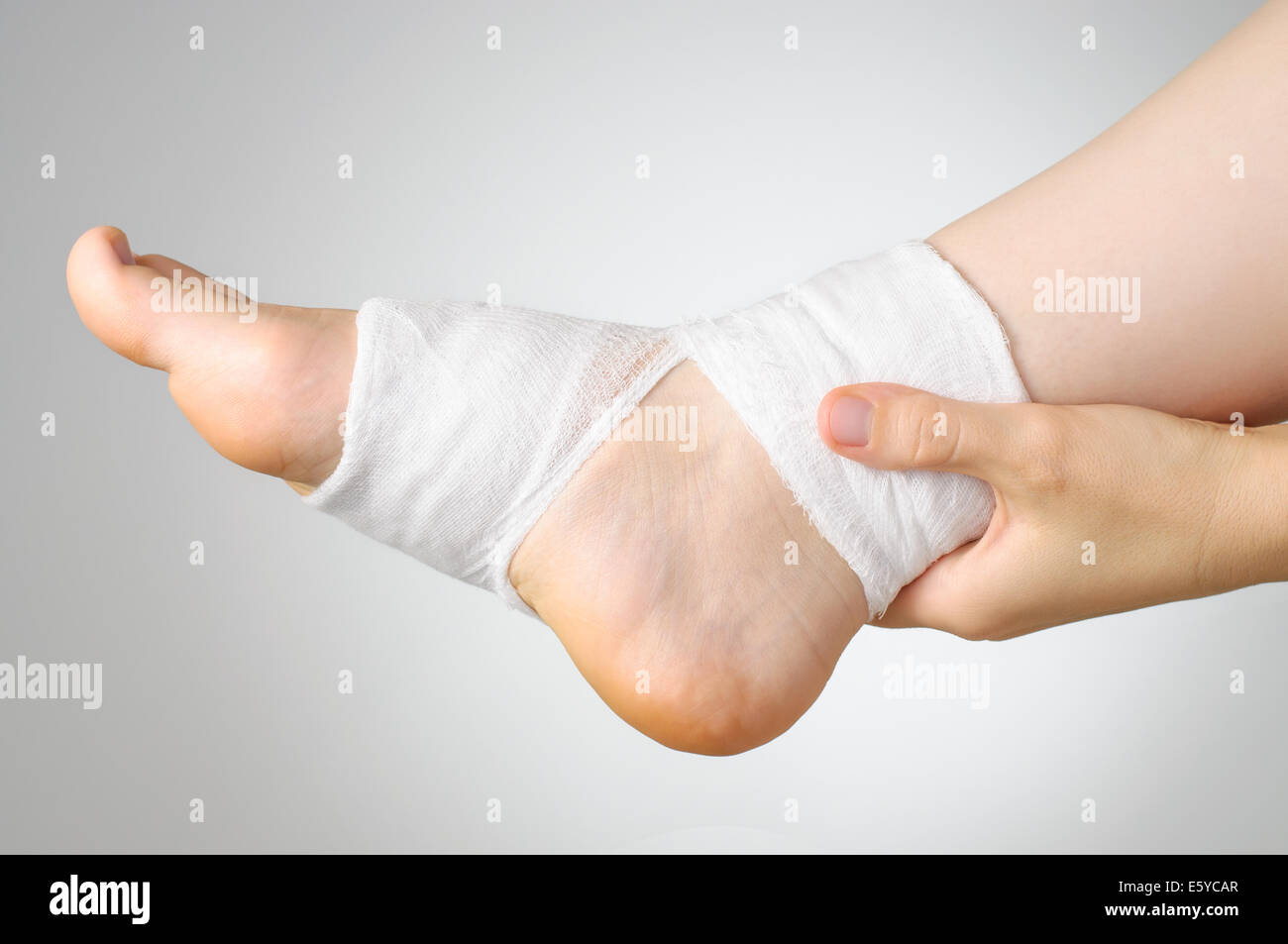 Injured foot with white gauze bandage Stock Photo - Alamy