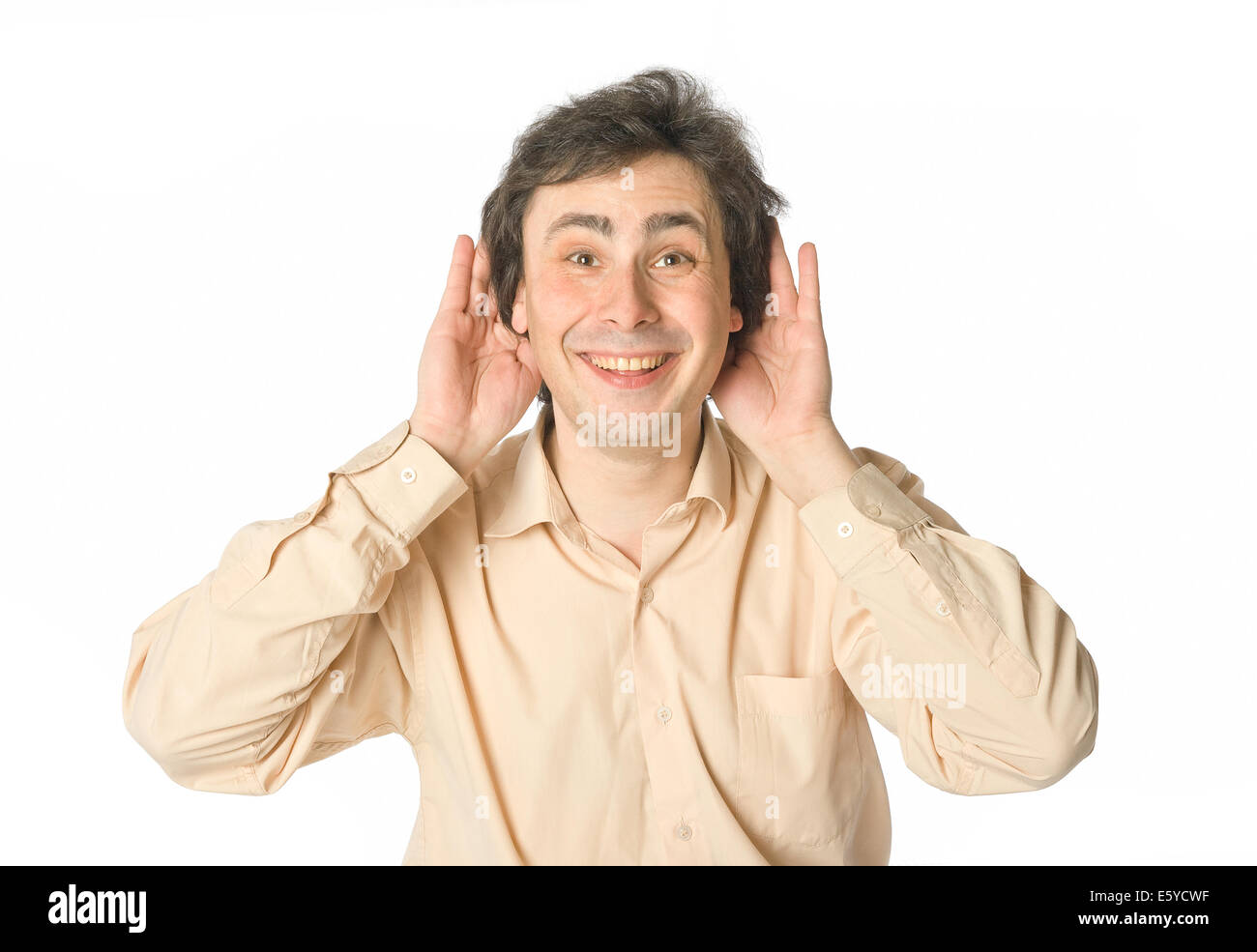 A man listening to something with a smile Stock Photo - Alamy