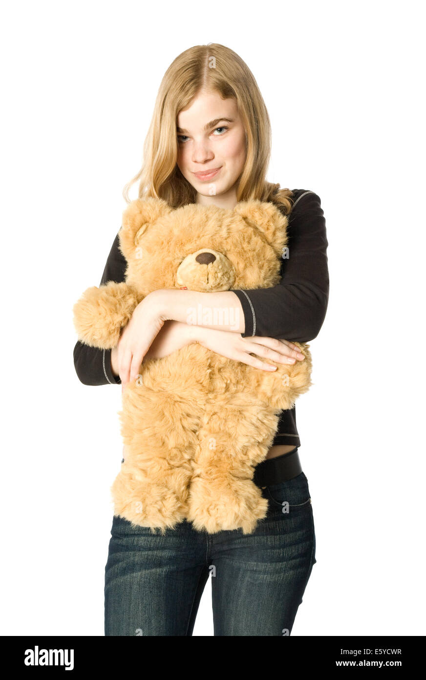 Young girl hugging a teddy bear, isolated Stock Photo - Alamy
