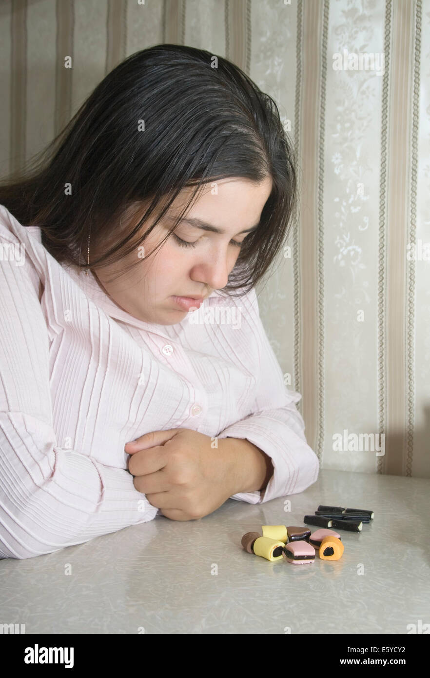 Overeating sweets hi-res stock photography and images - Alamy