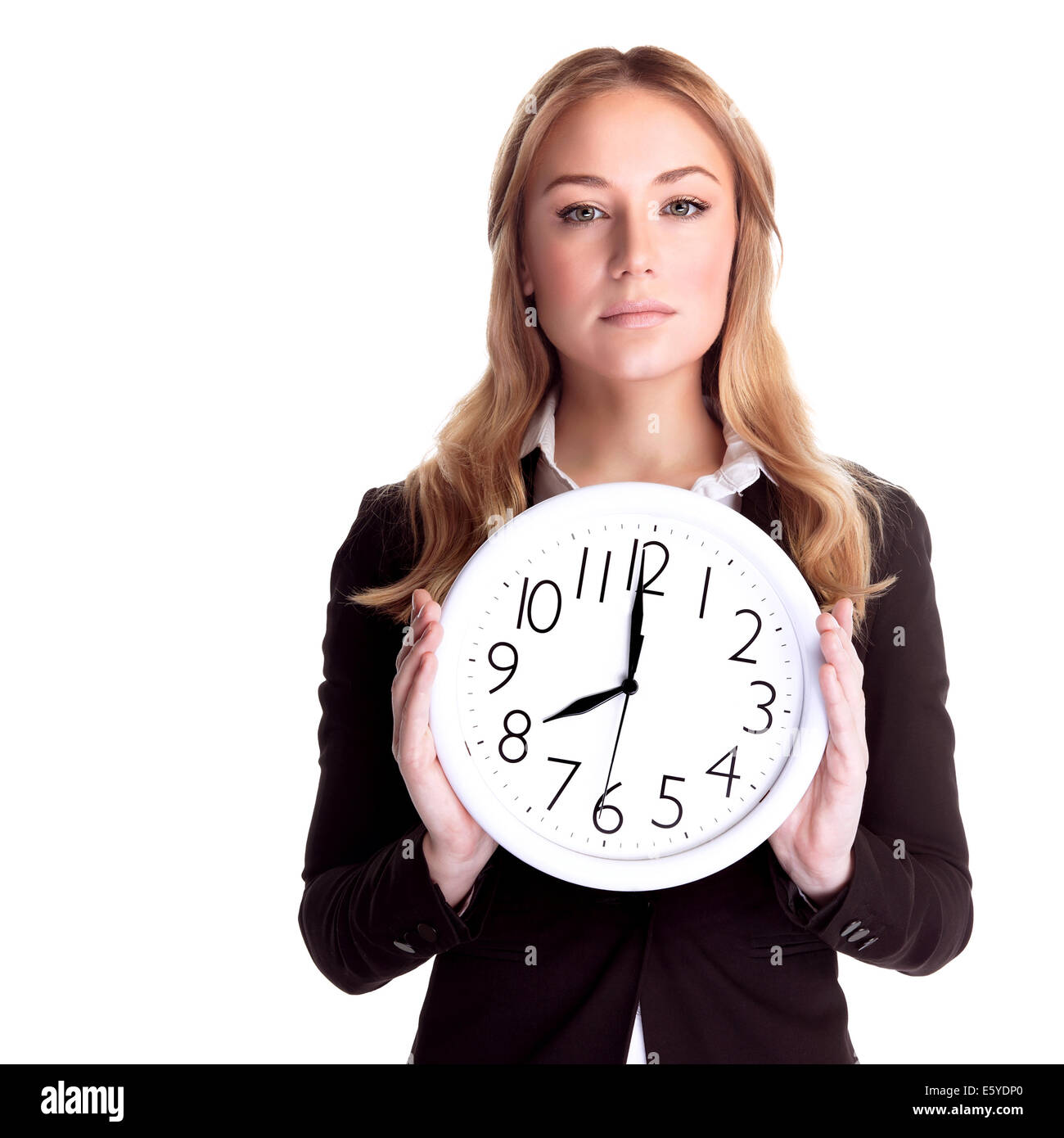 Portrait of beautiful blond woman wearing suit holding in hands clock ...