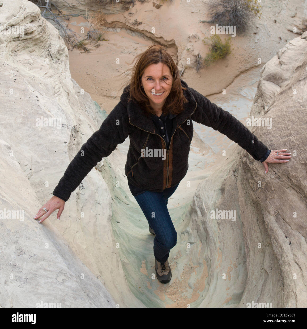 Happy woman moving up on rock, Utah, USA Stock Photo - Alamy