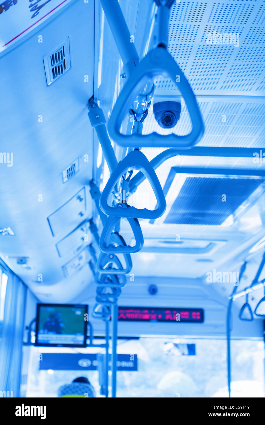 Handles standing passenger inside bus transportation hi-res stock ...