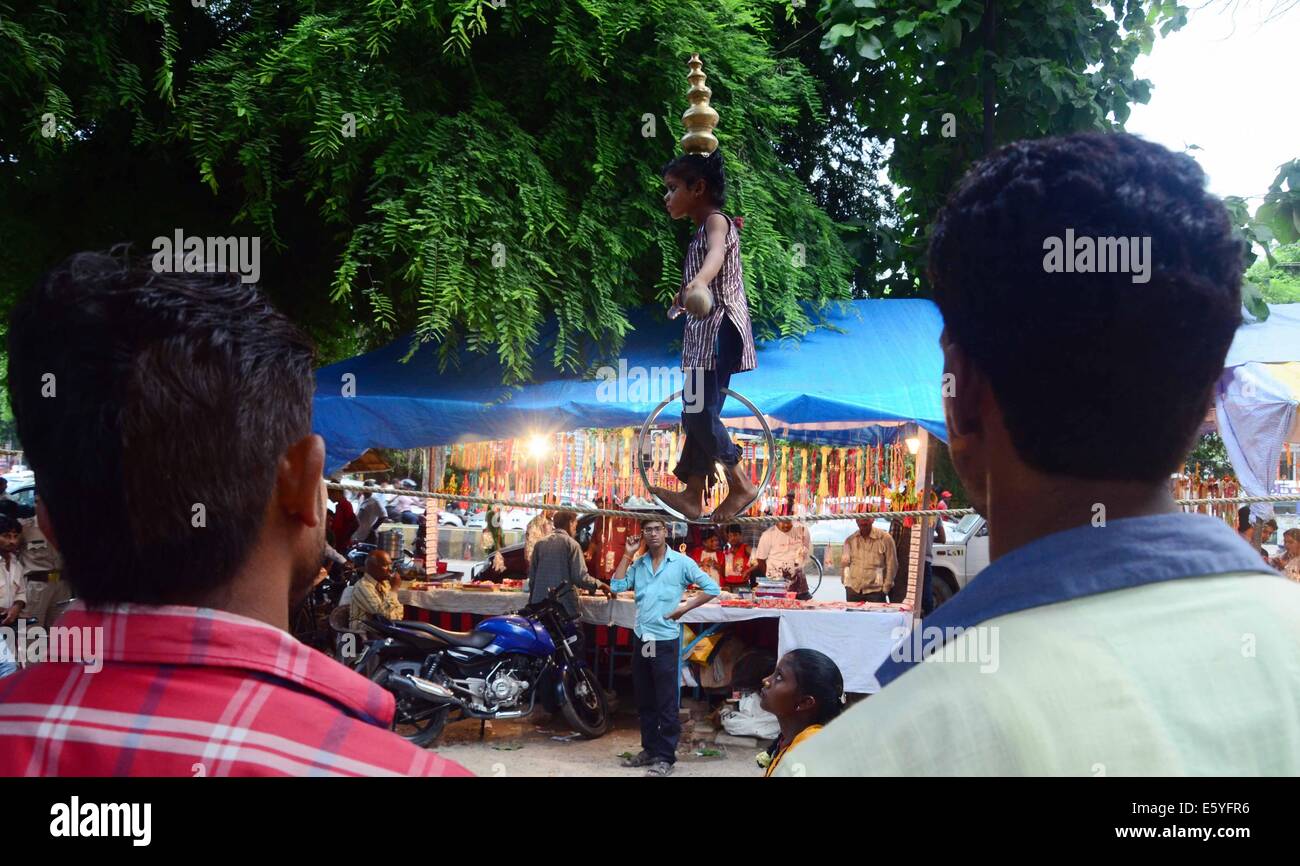 Neelam, a five-year-old Vilaspuri girl, performs tight-rope walking to ...