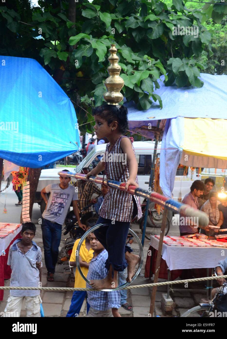 Neelam, a five-year-old Vilaspuri girl, performs tight-rope walking to ...