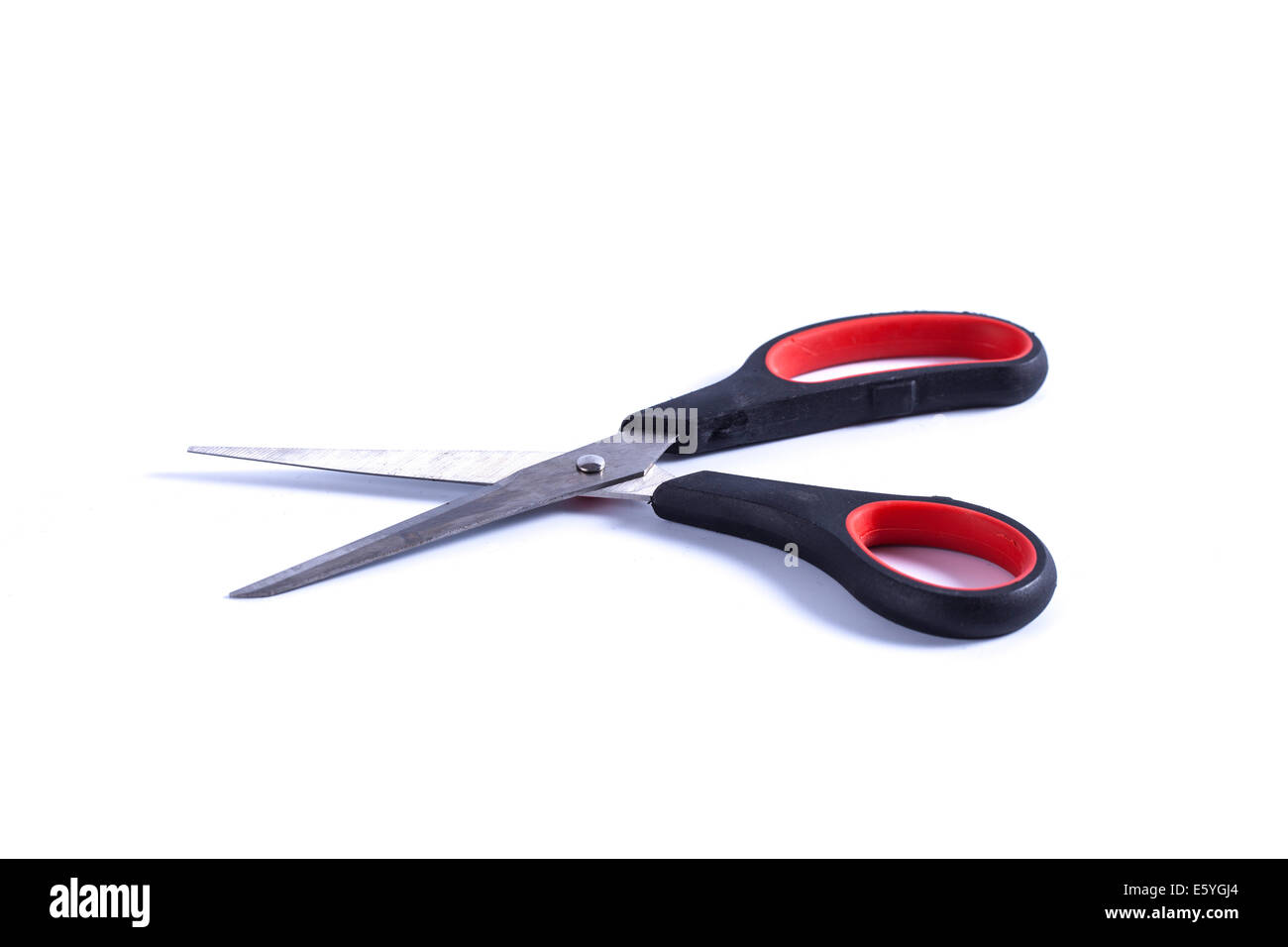 Pair of red and black scissors isolated on white Stock Photo - Alamy