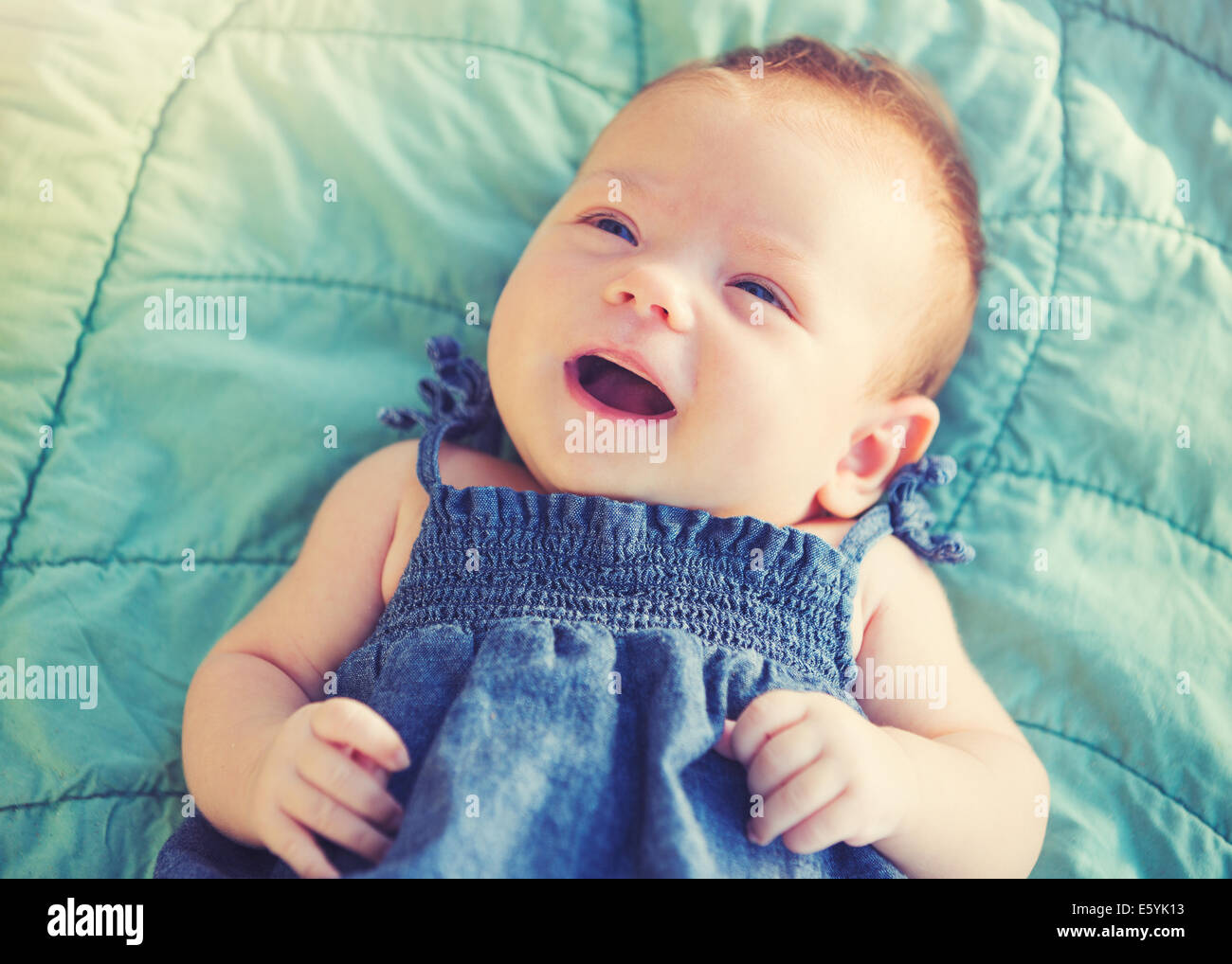 Cute newborn baby girl smiling Stock Photo - Alamy