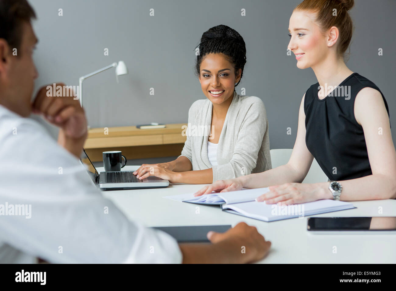 Young people in the office Stock Photo - Alamy