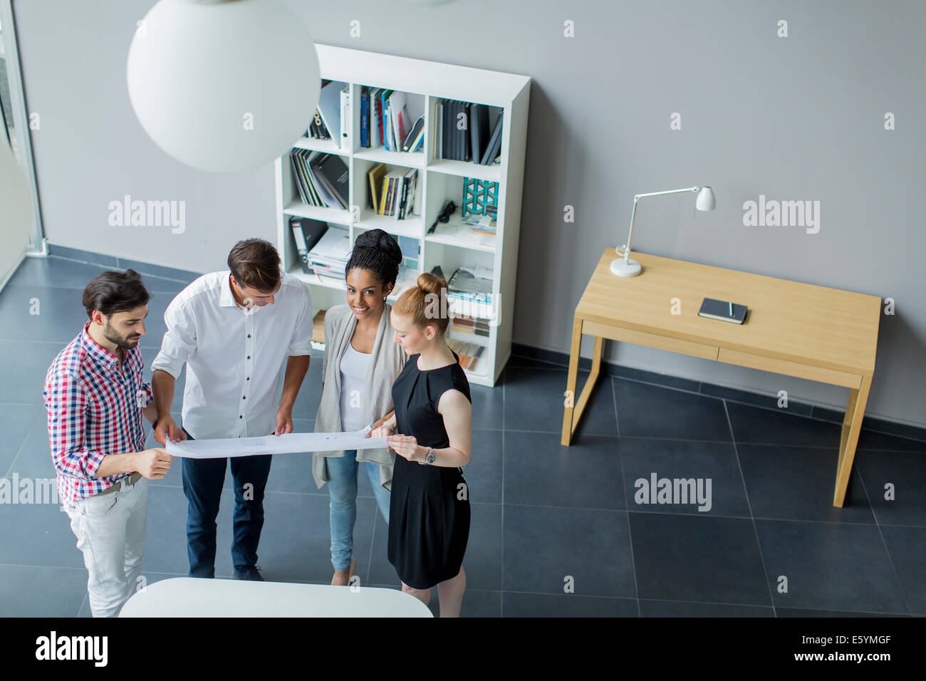 Young people in the office Stock Photo - Alamy