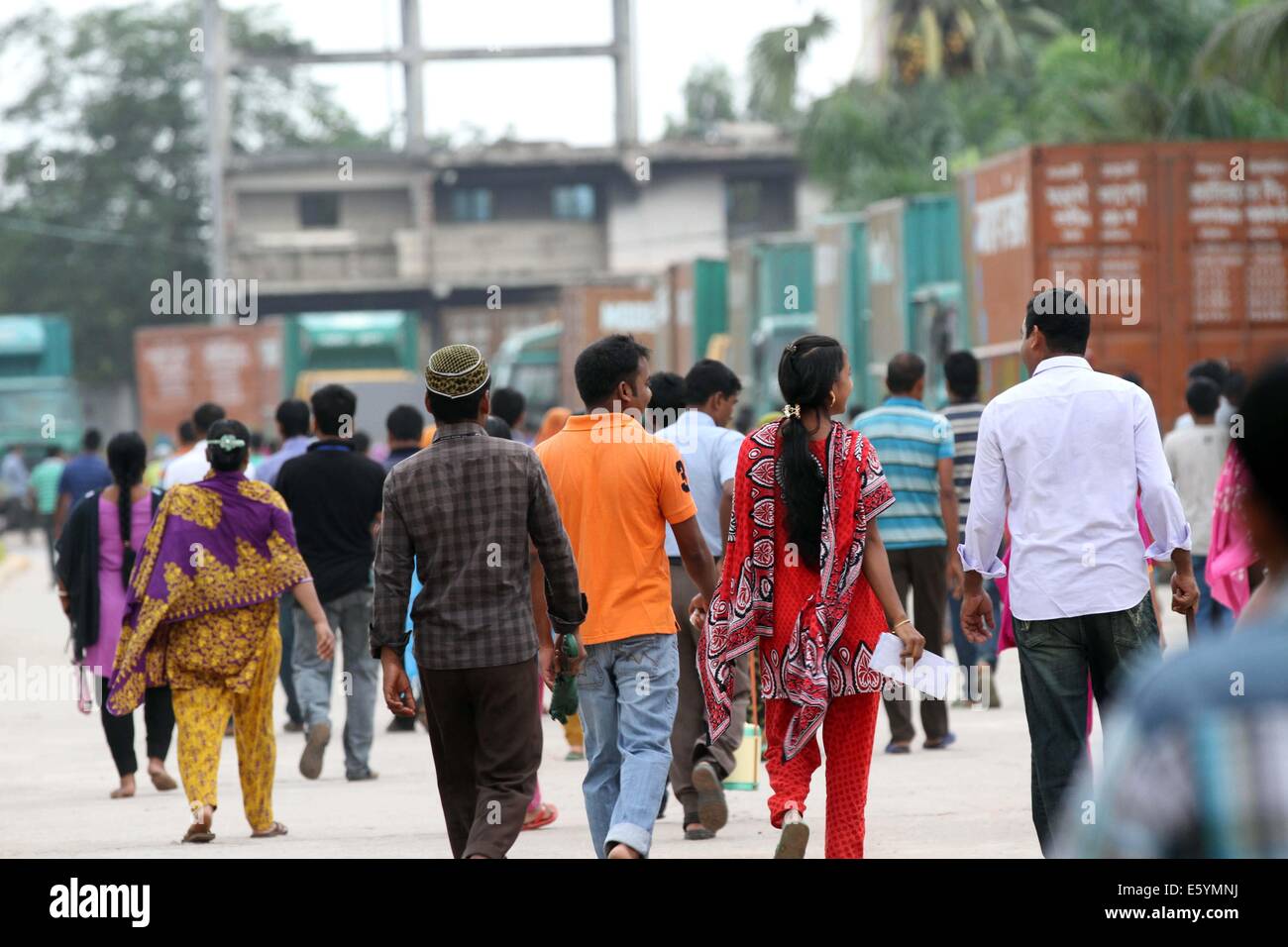 Garment workers are in a long queue to join their workplace in Ashulia ...