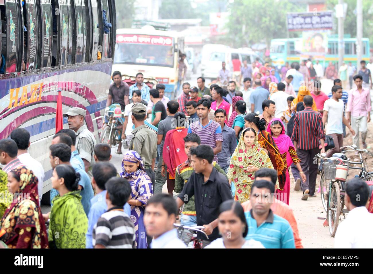 Garment workers are in a long queue to join their workplace in Ashulia ...