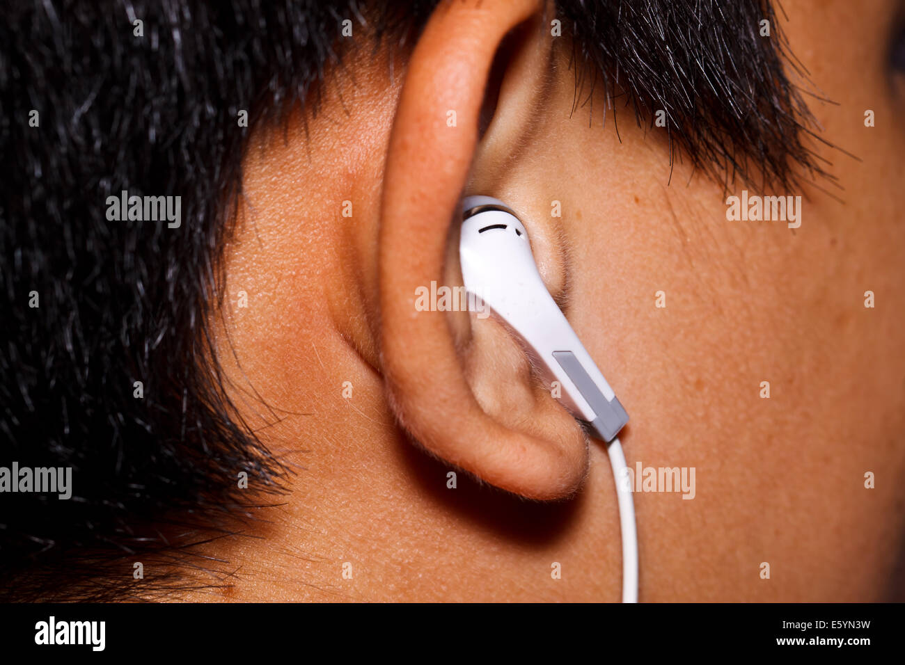 ear phone in ear Stock Photo - Alamy