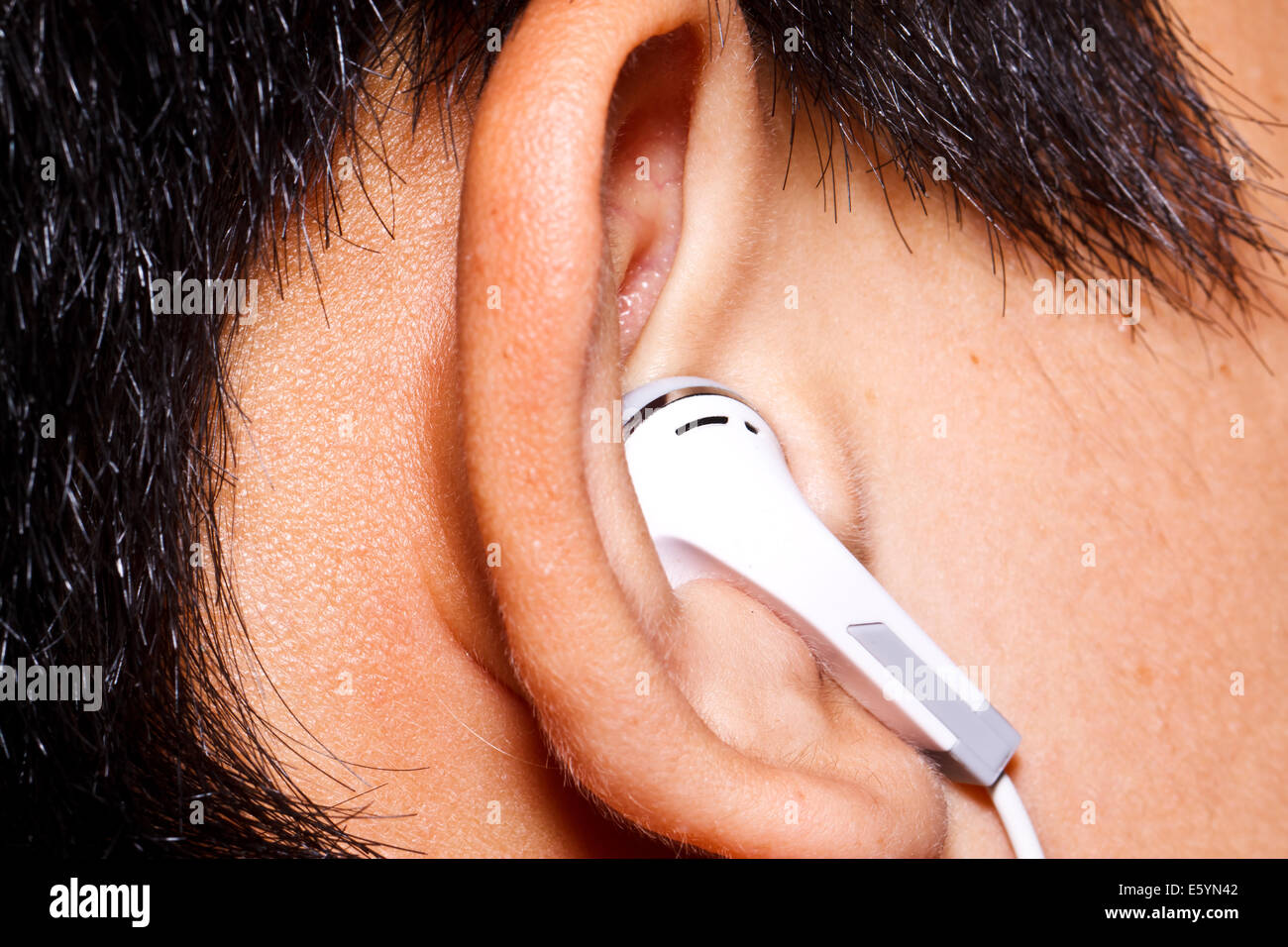 ear phone in ear Stock Photo - Alamy