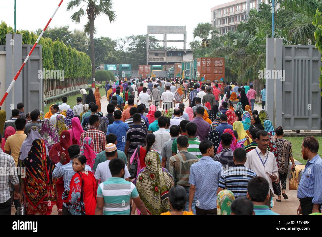 Garment workers are in a long queue to join their workplace in Ashulia ...