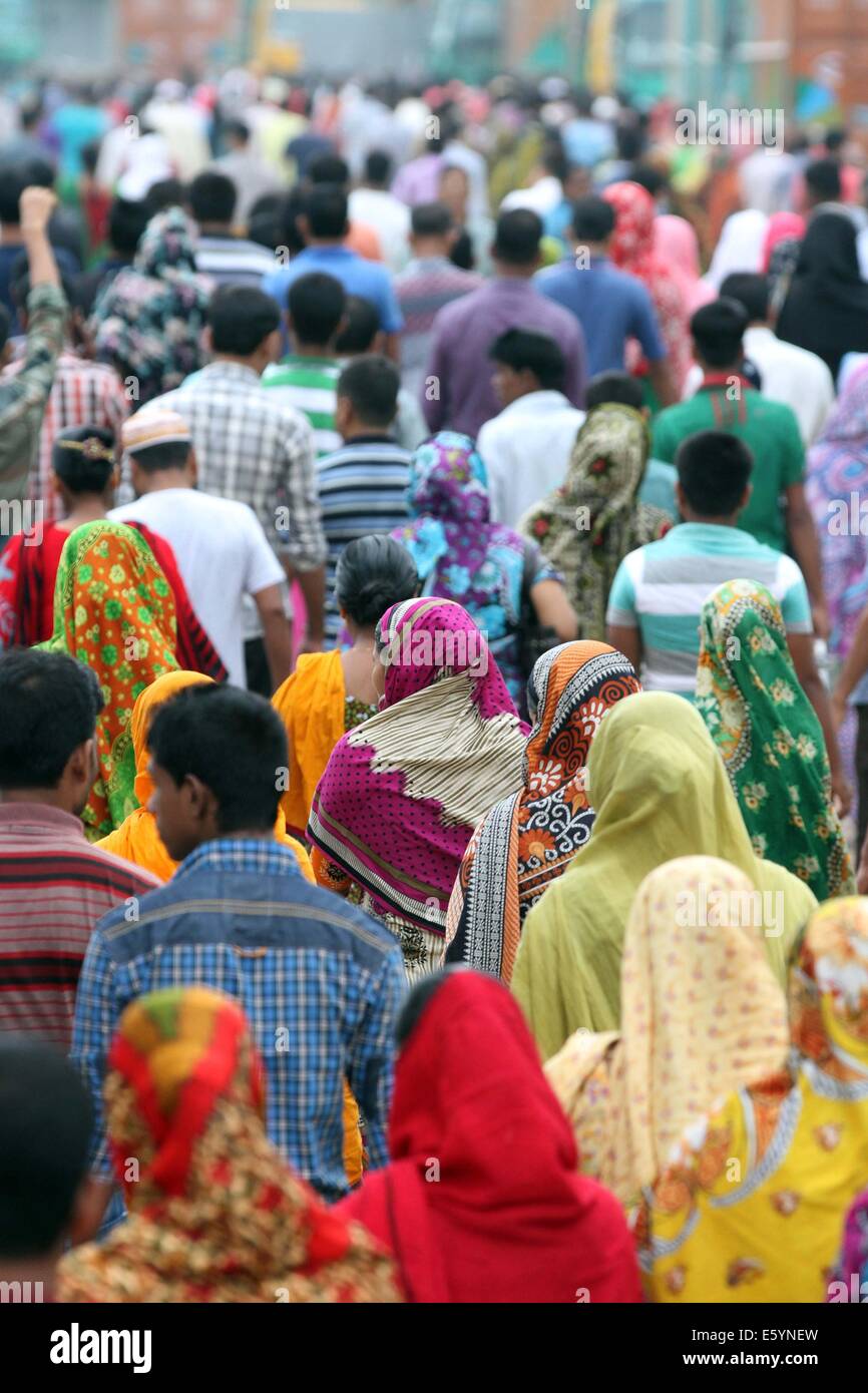 Garment workers are in a long queue to join their workplace in Ashulia ...